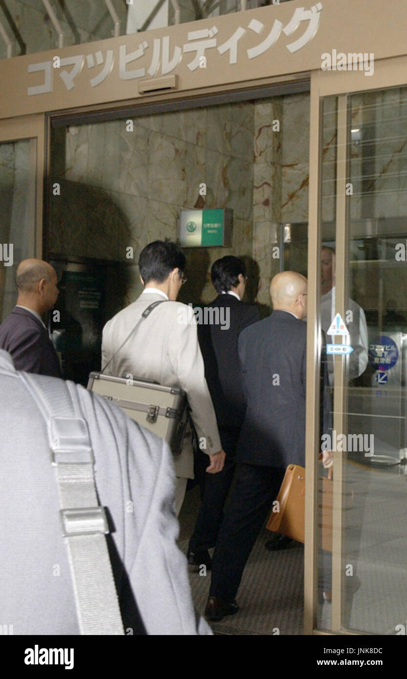 TOKYO, Japan - Police raid the headquarters of Komatsu Ltd. in Tokyo on ...