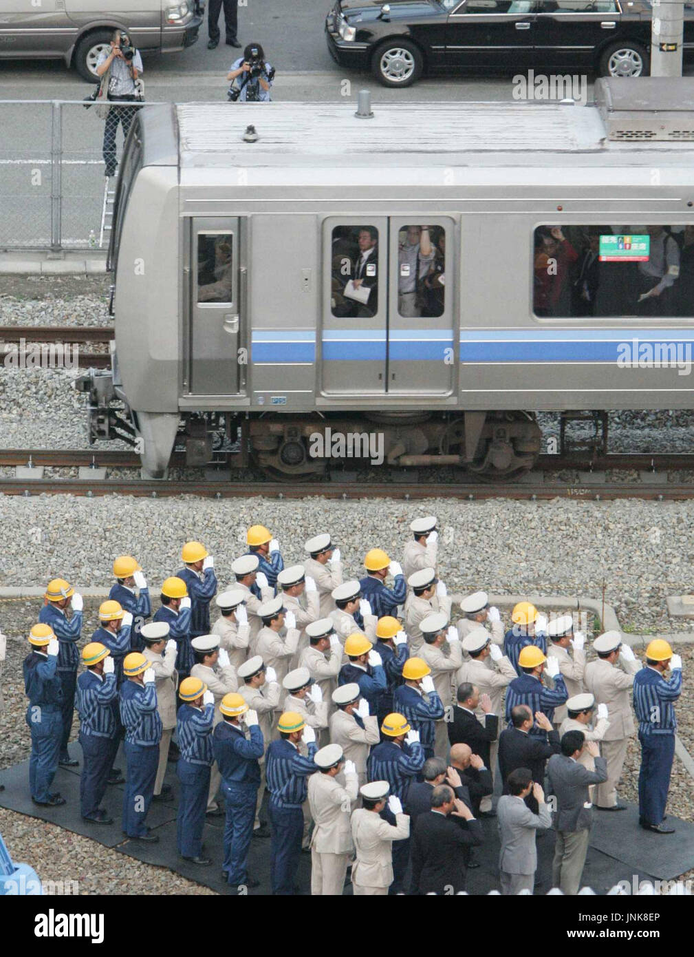 AMAGASAKI, Japan - West Japan Railway Co. employees salutes a JR West ...