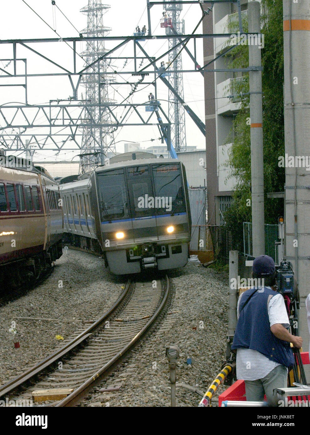 AMAGASAKI, Japan - West Japan Railway Co. trains pass the April 25 ...