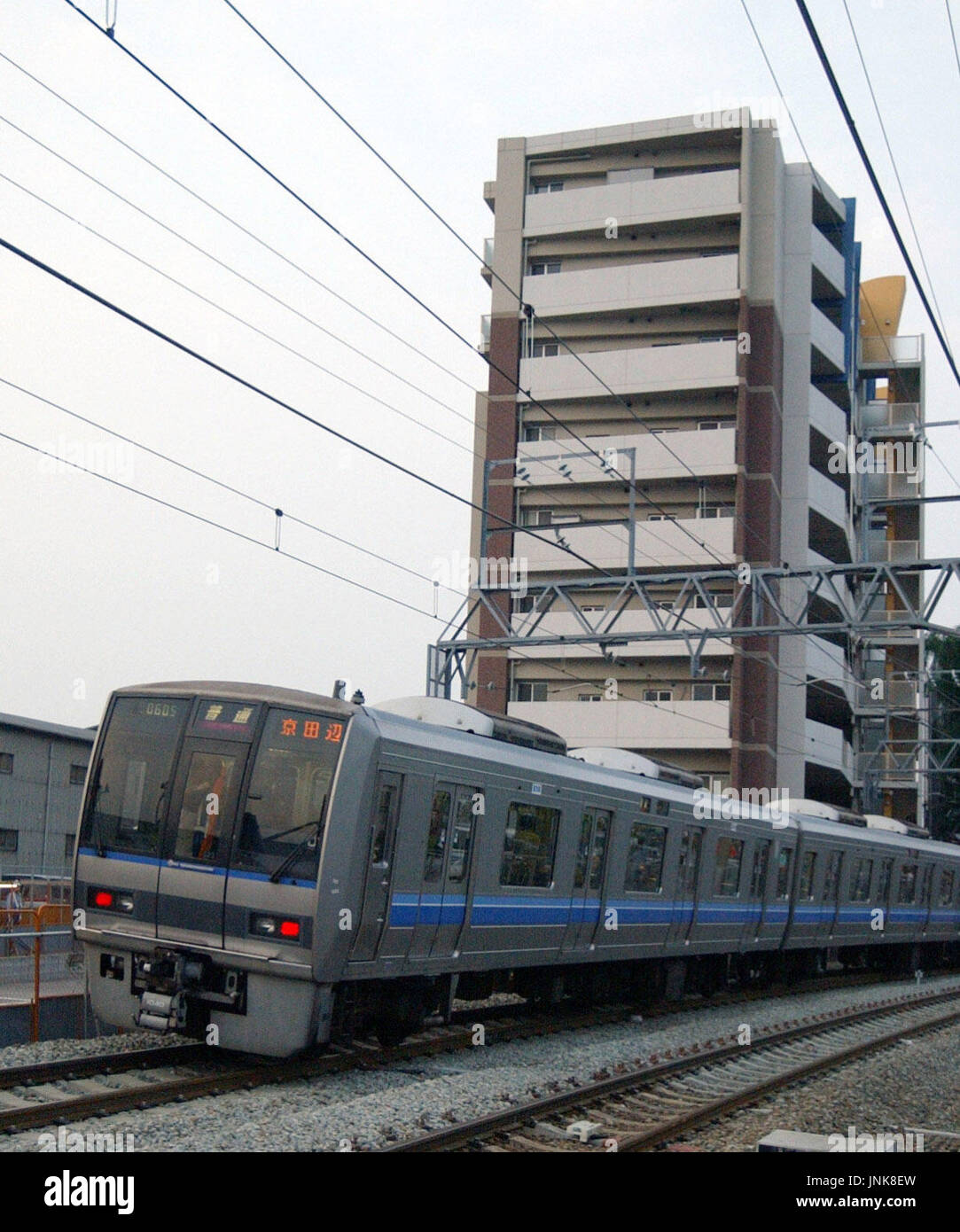 AMAGASAKI, Japan - A West Japan Railway Co. train passes the April 25 fatal derailment accident ...