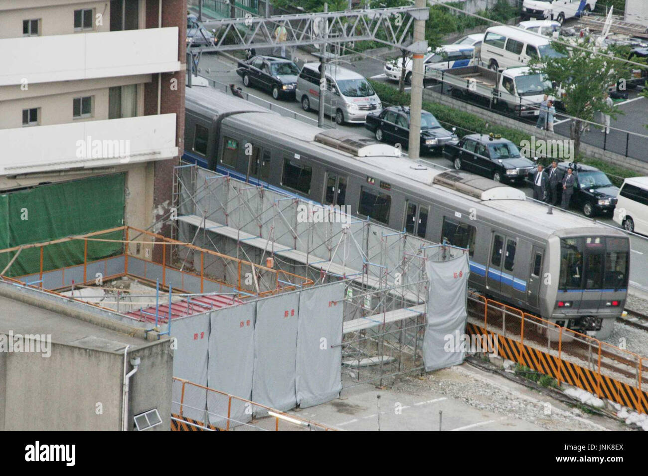 AMAGASAKI, Japan - A West Japan Railway Co. train passes the April 25 ...