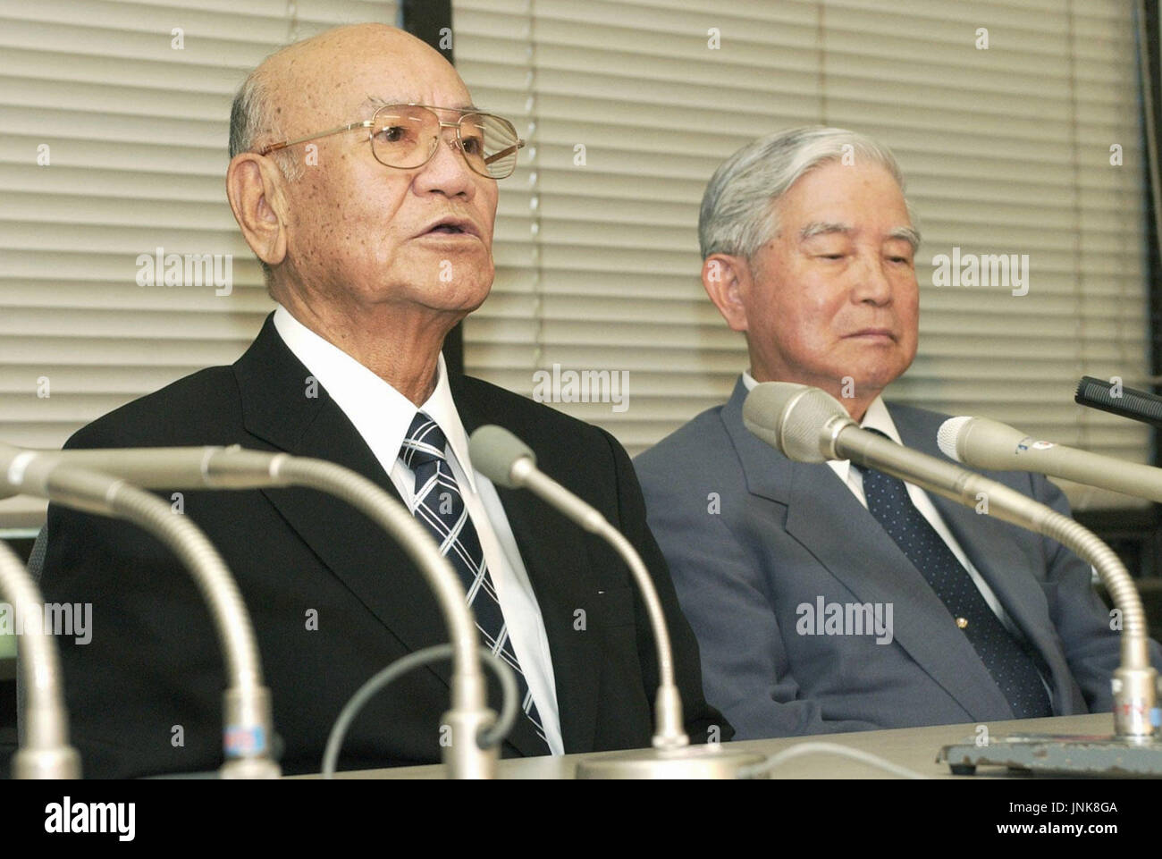 TOKYO, Japan - Choken Ginoza (L), who lost 10 members of his family in ...