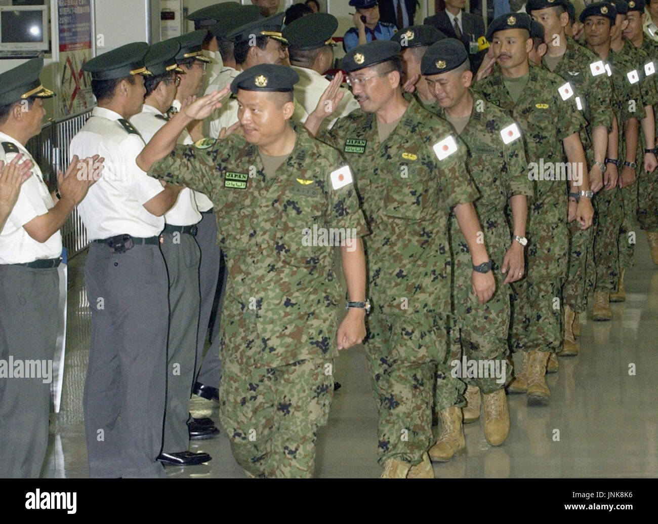 TOKYO, Japan - A group of Ground Self-Defense Force members leave Tokyo ...
