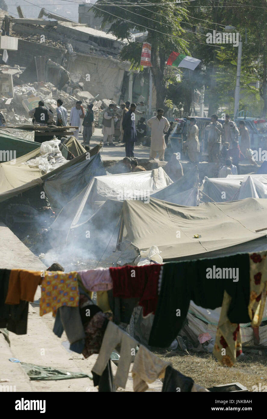 MUZZAFARABAD, Pakistan - Smoke trails out of tents before the dinner ...