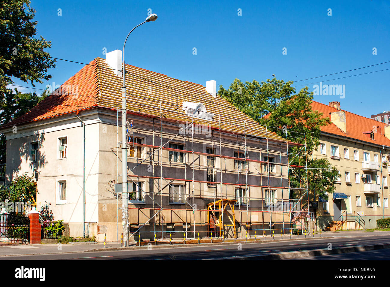 repair of a residential building outside in the city on summer day ...