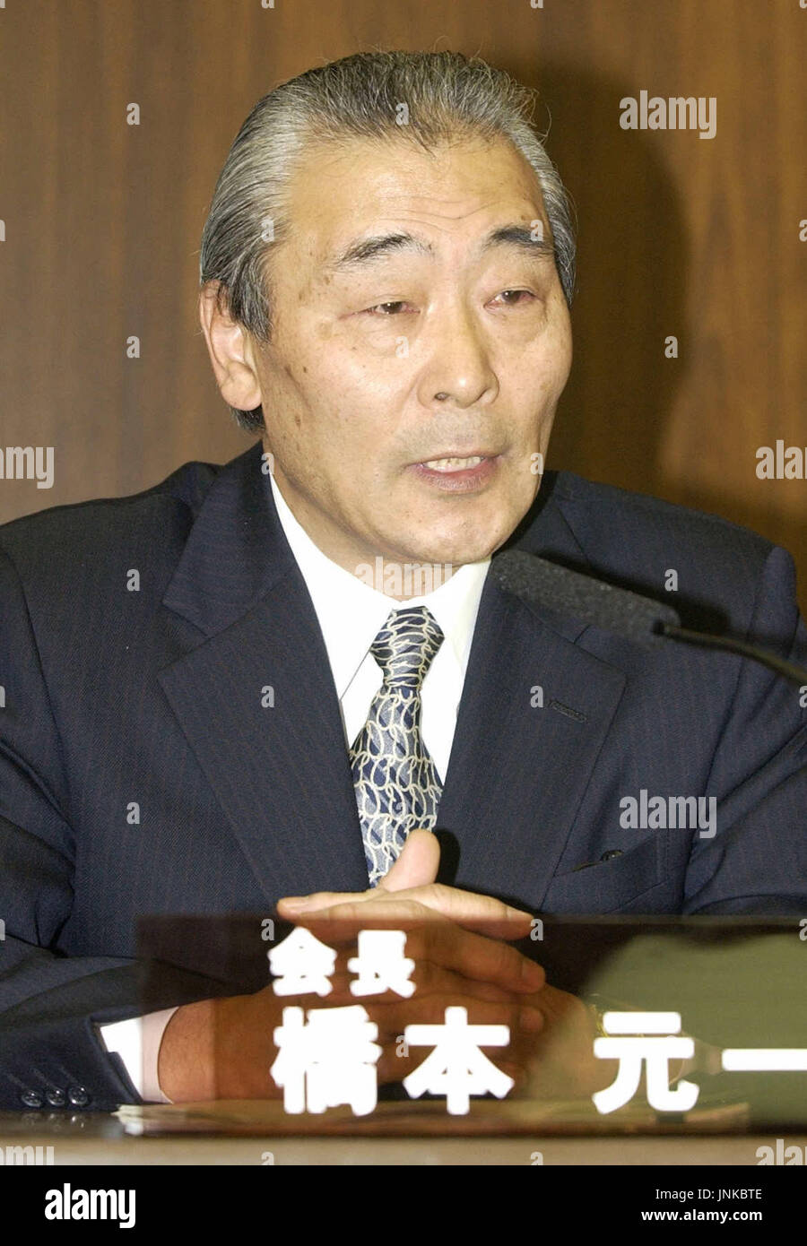 TOKYO, Japan - NHK President Genichi Hashimoto speaks in reply to a ...