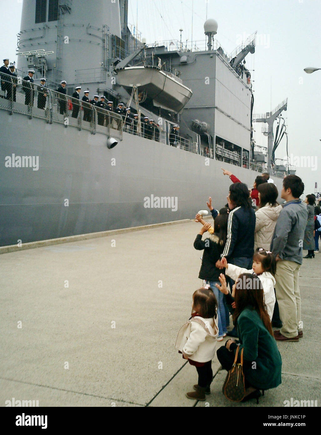 YOKOSUKA, Japan - Family members of crewmen bid farewell as the 8,150 ...