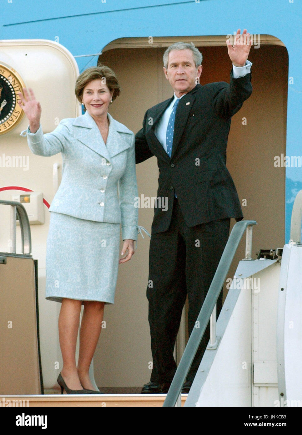 OSAKA, Japan - U.S. President George W. Bush and his wife Laura wave at ...