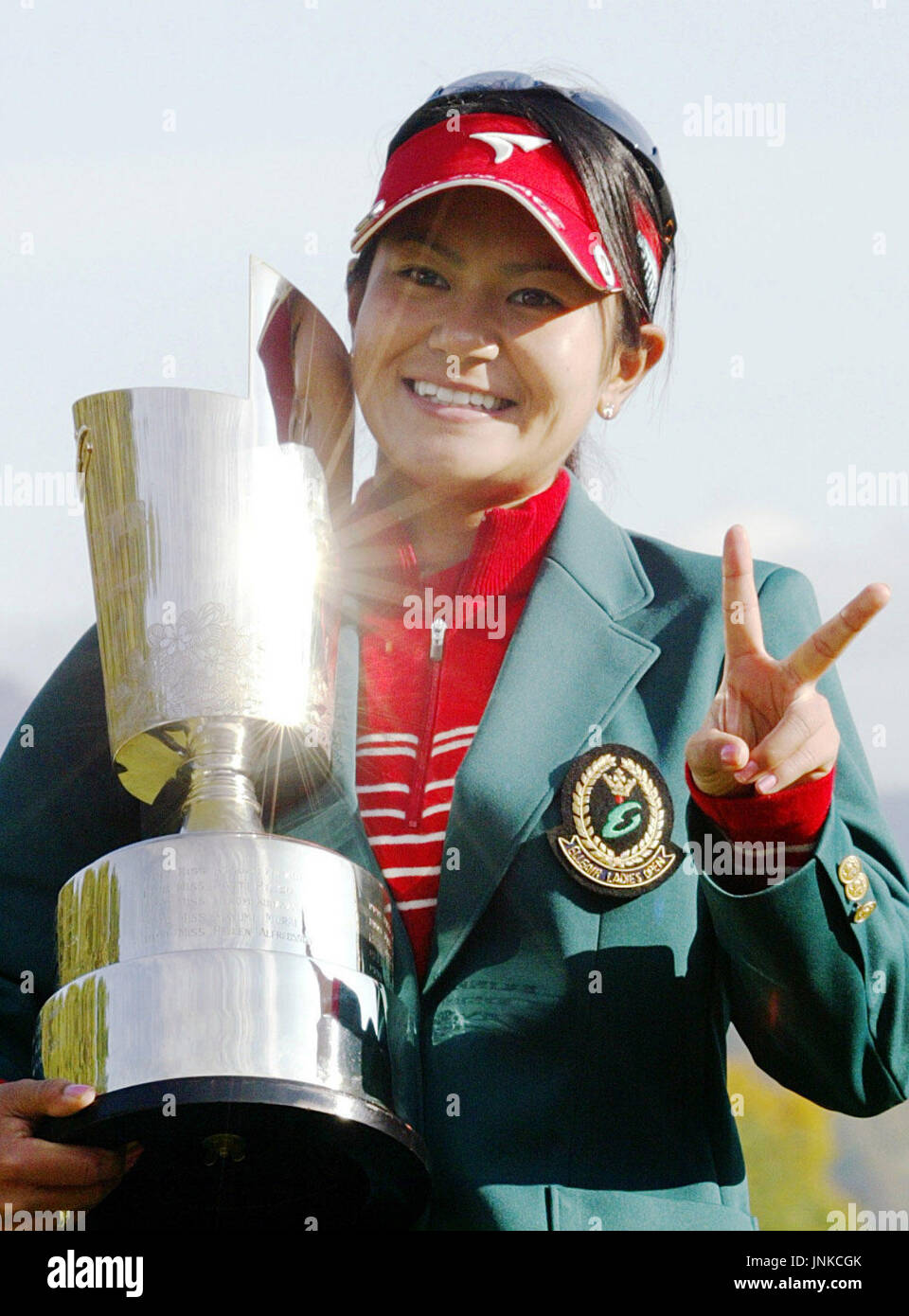 MATSUYAMA, Japan - Ai Miyazato flashes a victory sign at Elleair Golf ...