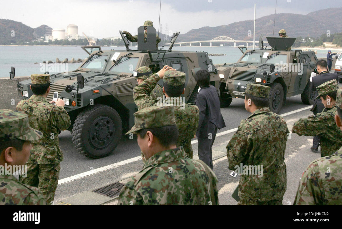 TSURUGA, Japan - Ground Self-Defense Force troops and vehicles are on ...