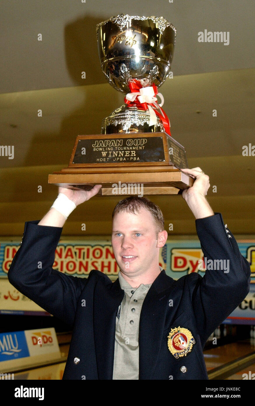 YOKOHAMA, Japan - Tommy Jones holds up his trophy at Shin Yokohama ...