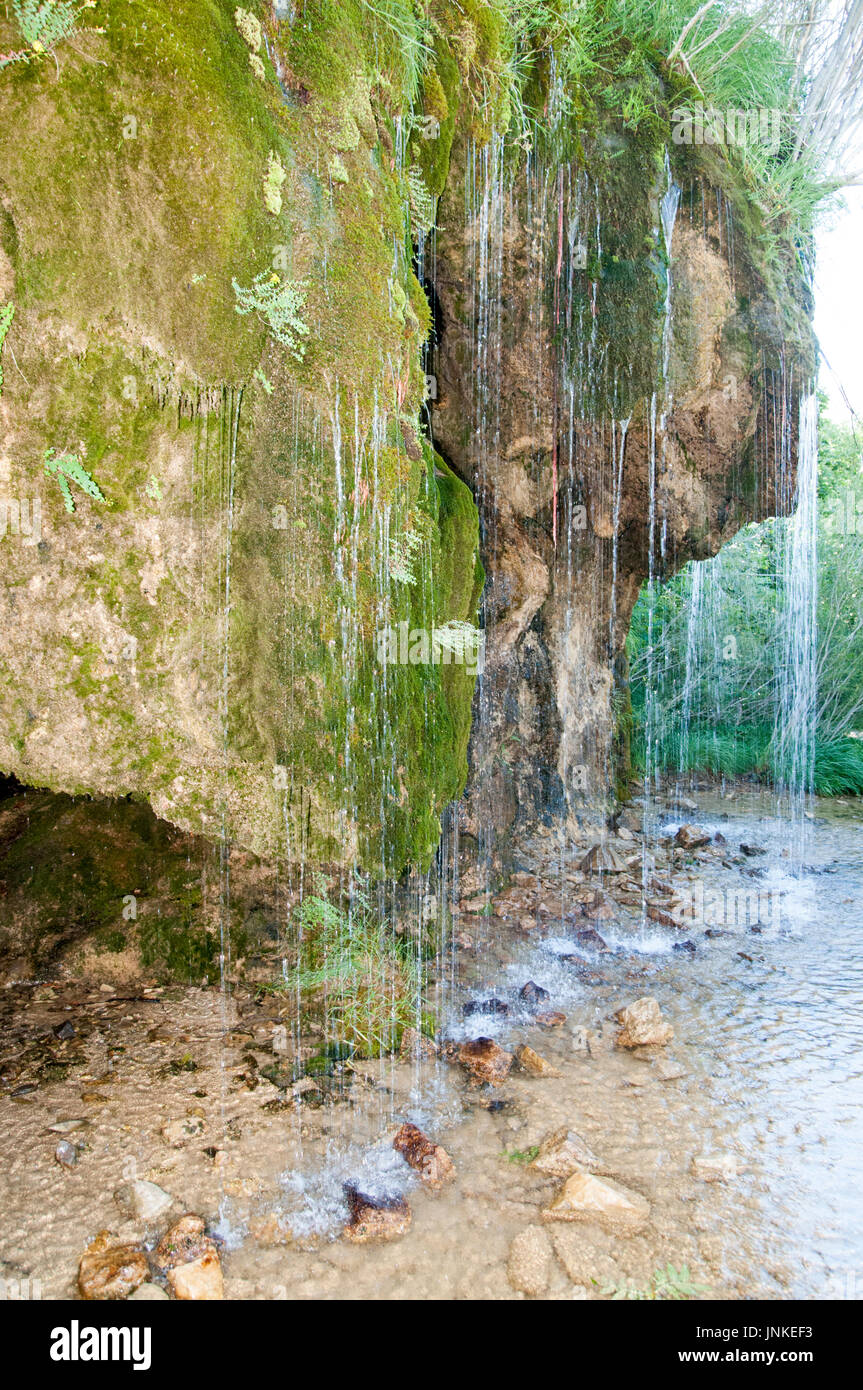 Delicate waterfall of fresh spring water near the Ermita de Sta Elena ...