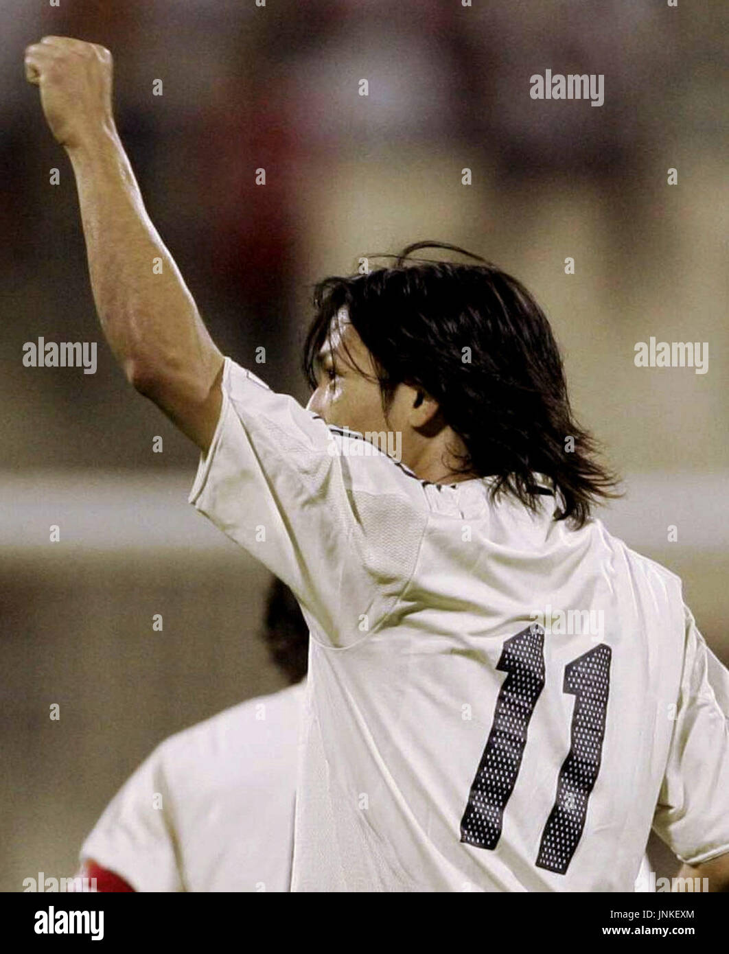 MUSCAT, Oman - Japan striker Takayuki Suzuki reacts after scoring the ...
