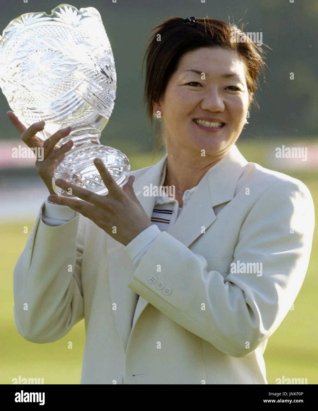 CHIBA, Japan - Michiko Hattori holds up her trophy after winning the ...