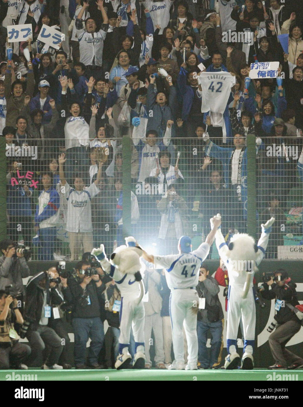 TOKOROZAWA, Japan - Alex Cabrera (42) responds to fans after the Seibu ...