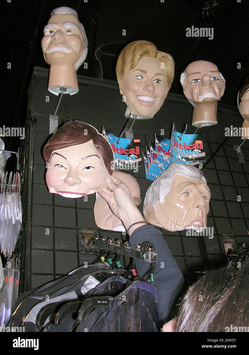 NEW YORK, United States - Masks featuring President George W. Bush (top ...