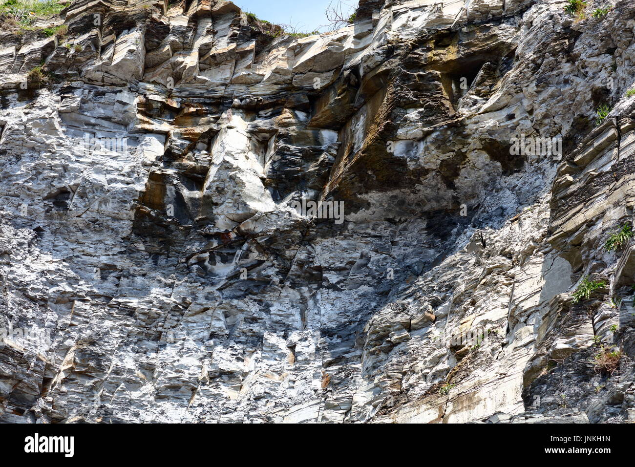 Geological cliff structures with limestone and soft crumbling oil ...
