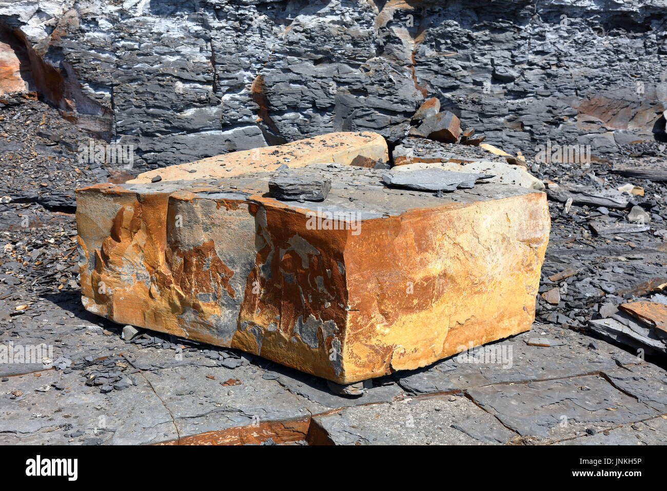 Massive mineral stained limestone block recently broken away from ...