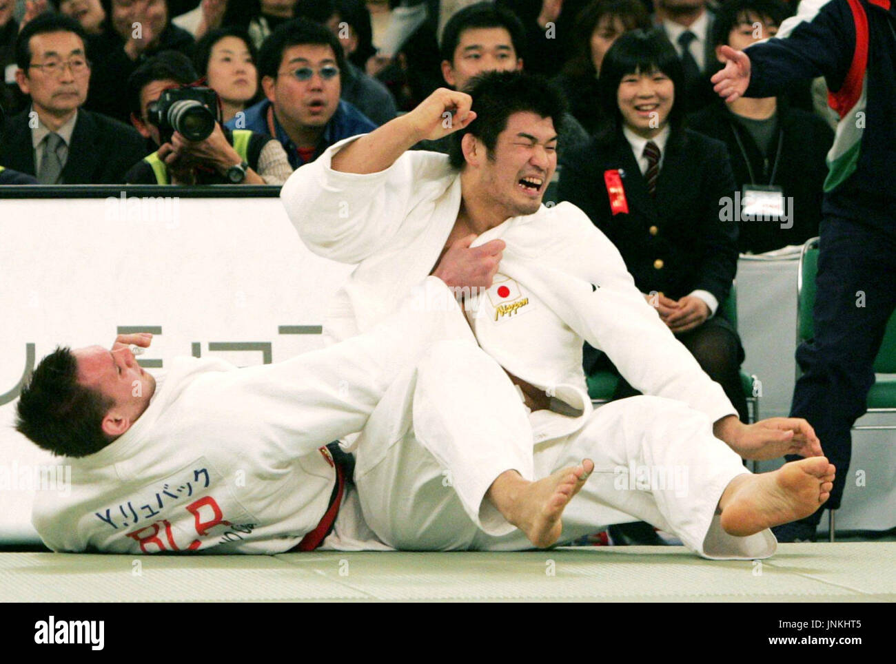 TOKYO, Japan - Japanese heavyweight judoka Kosei Inoue (R) bursts into joy after toppling Yury ...