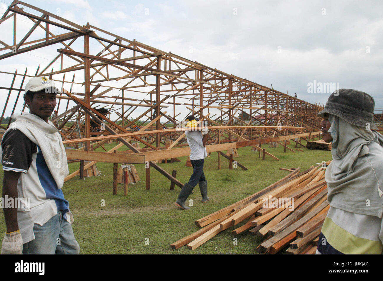 BANDA ACEH, Indonesia - Workers build makeshift houses for earthquake ...