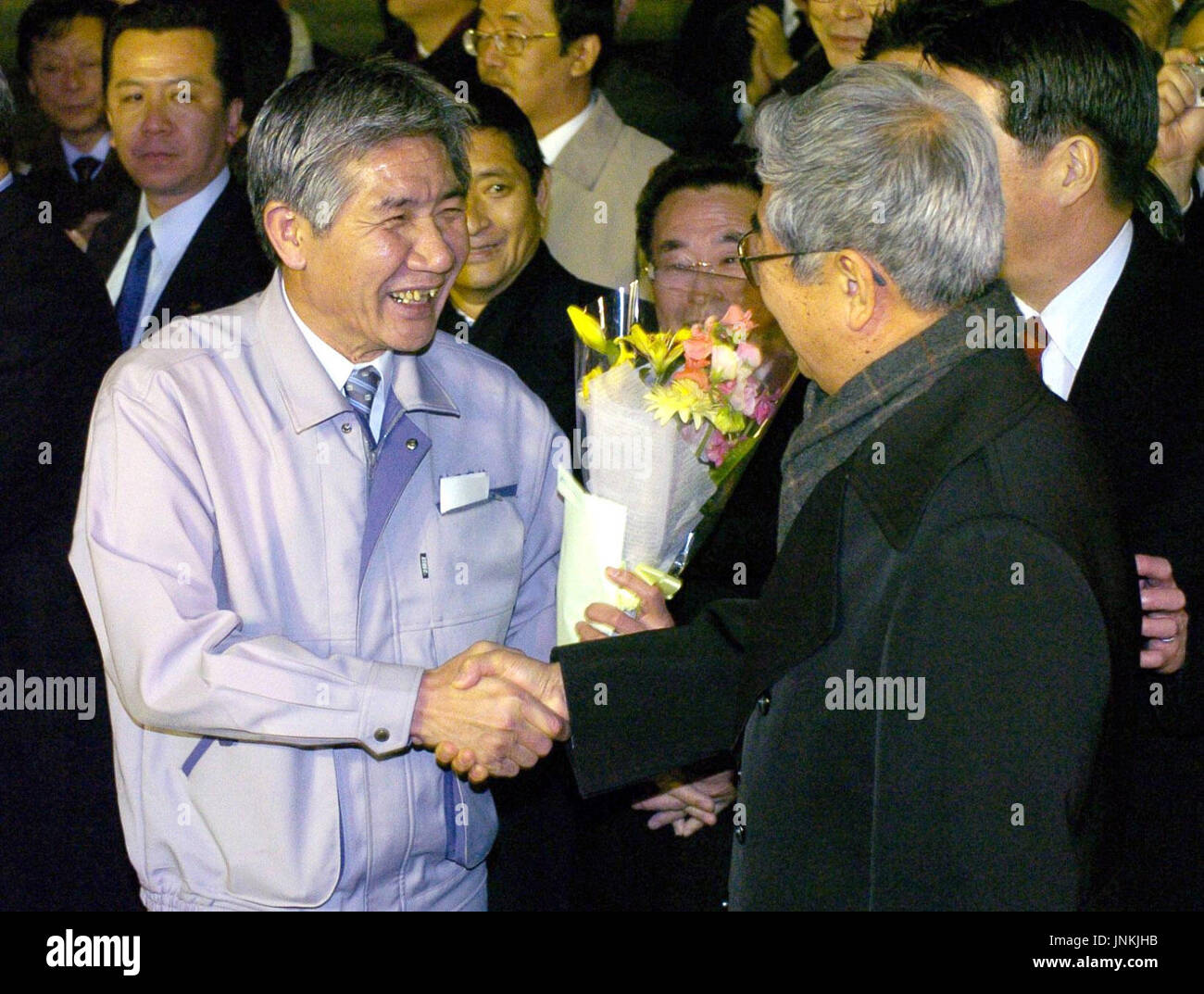 TOKYO, Japan - Miyake Village Mayor Sukeyasu Hirano (R) smiles as he ...