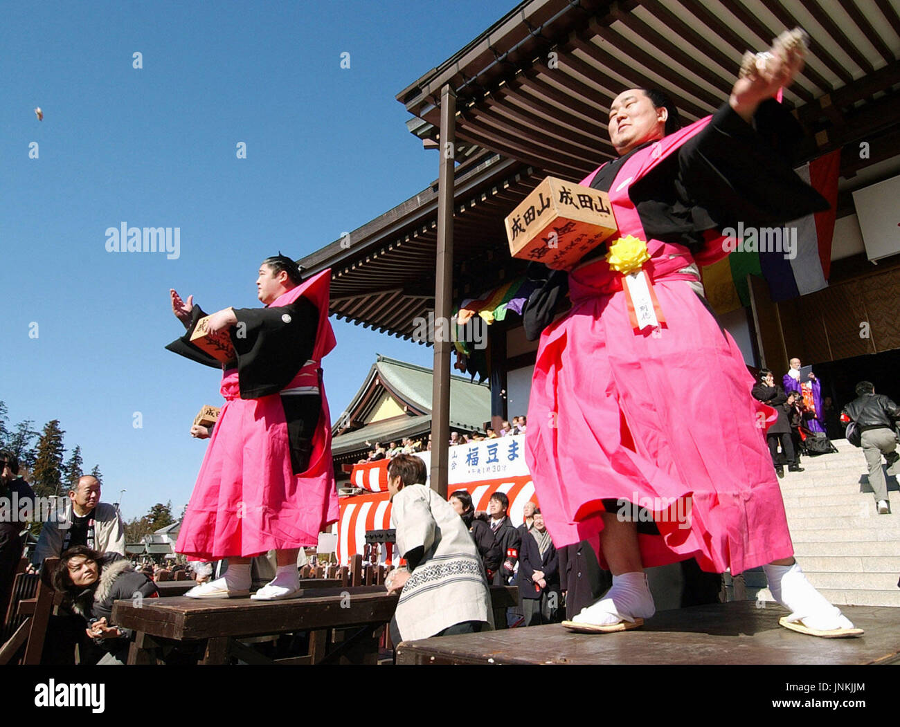 NARITA, Japan - Mongolian yokozuna (R) scatters beans at Shinshoji ...