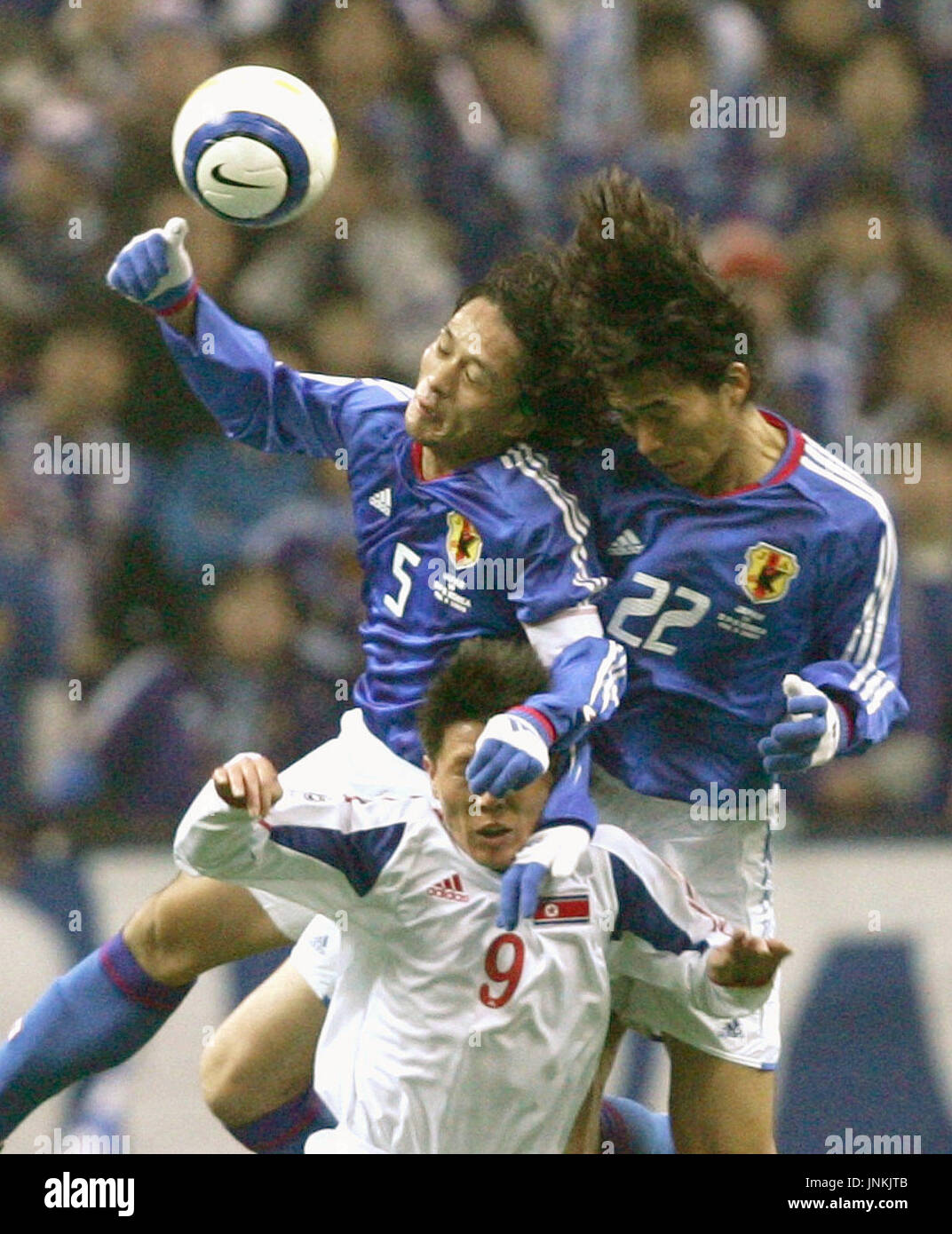 SAITAMA, Japan - North Korea striker Kim Yong Su (9), Japan defenders ...