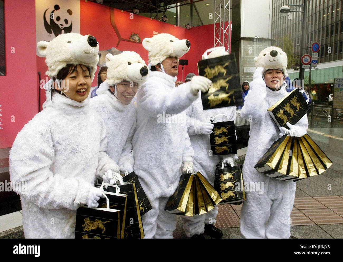 TOKYO, Japan - Volunteers dressed in the disguise of polar bears ...