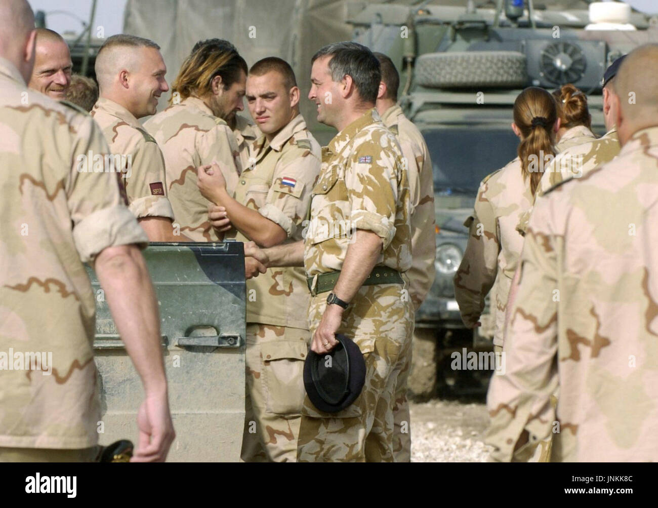 SAMAWAH, Iraq - British soldiers (C) shake hands with Dutch soldiers at ...