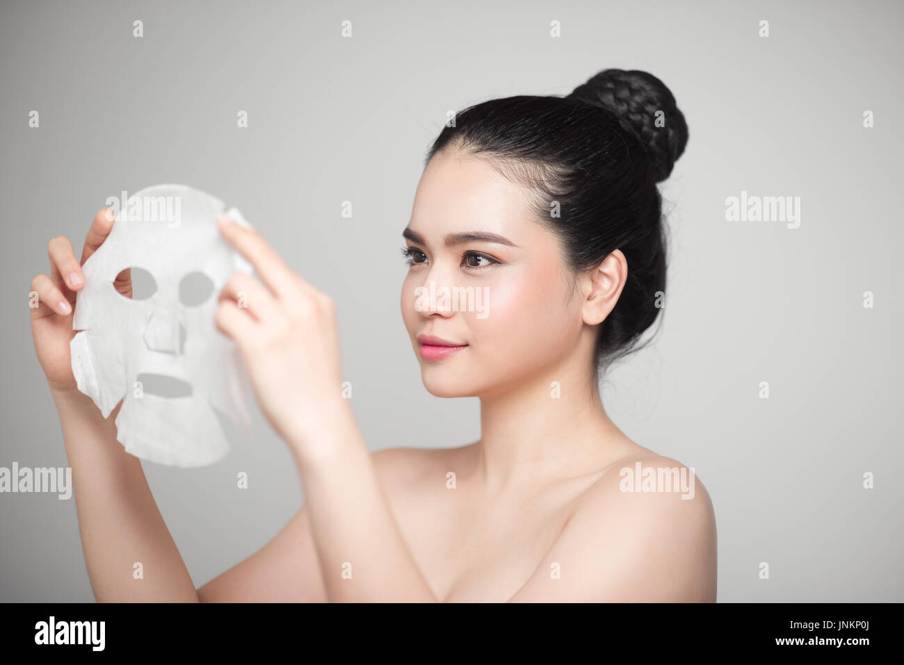 Spa, healthcare. Asian girl with a cosmetic mask Stock Photo - Alamy
