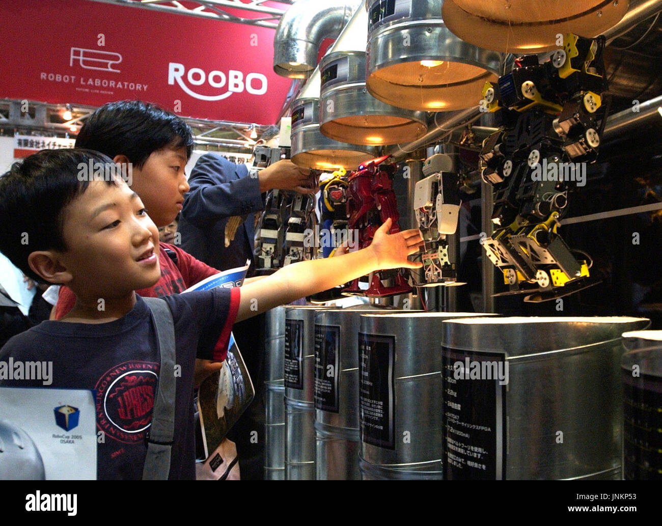 OSAKA, Japan - Boys look at robots displayed at the robotic soccer ...