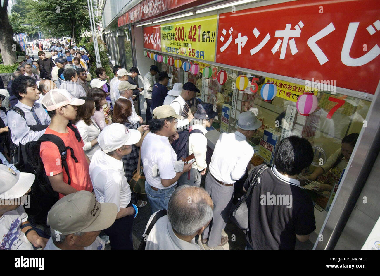 TOKYO, Japan - About 800 people line up in Tokyo's Ginza district July ...