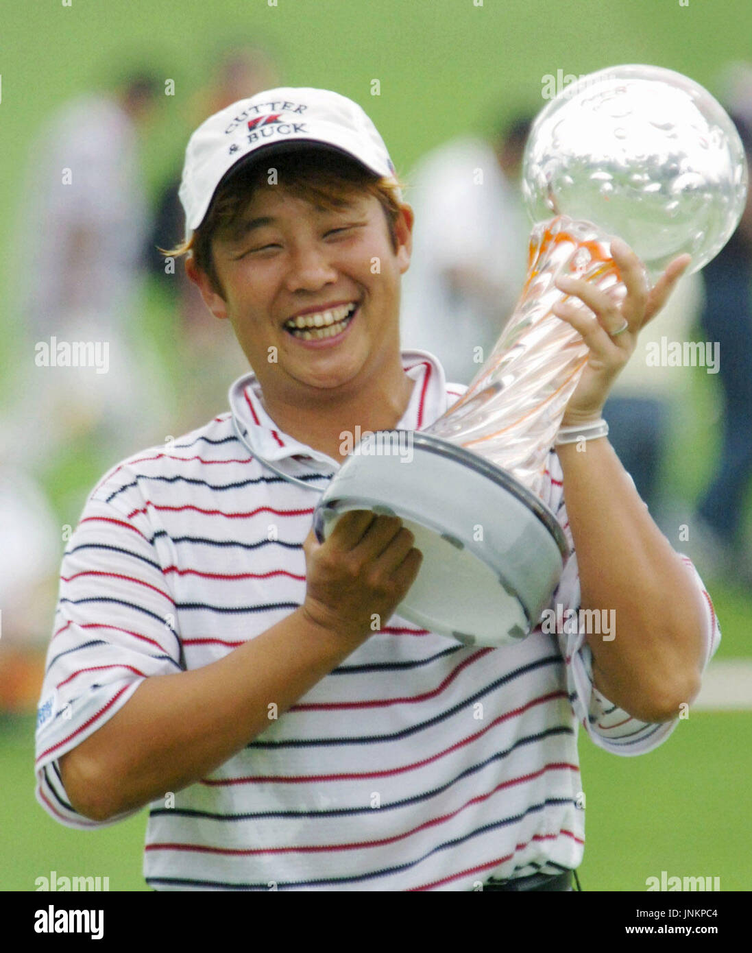 SUSONO, Japan - Junko Omote holds up her trophy after winning the ...