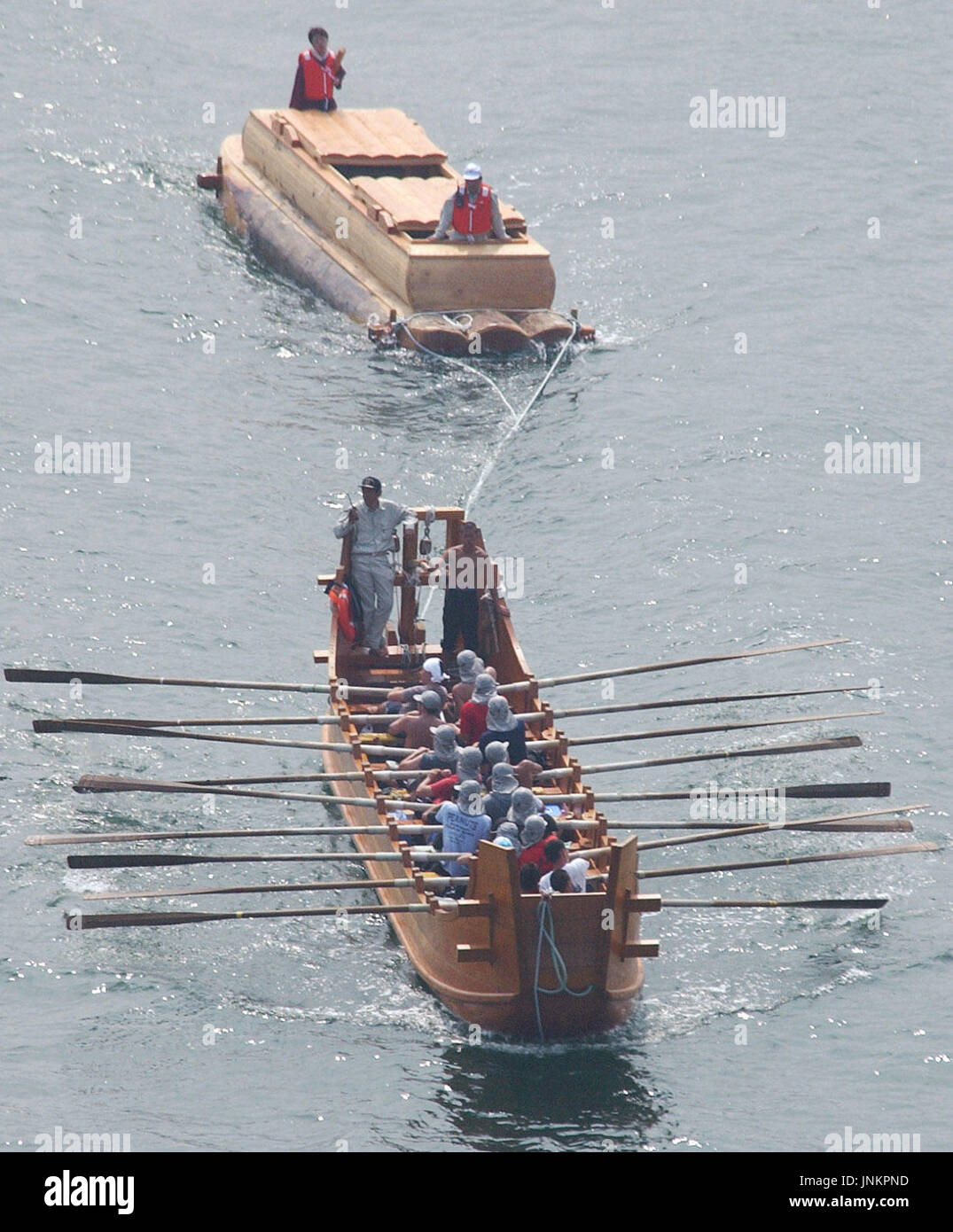UTO, Japan - A crew of 18 persons rows a replica of an ancient boat out ...