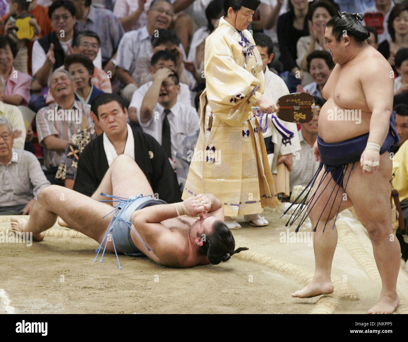 NAGIYA, Japan - Komusubi Kotooshu puts his hands on the face after ...