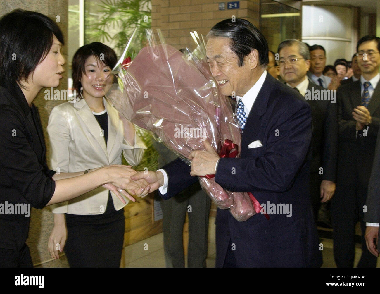 TOKYO, Japan - Dismissed farm minister Yoshinobu Shimamura leaves his ...