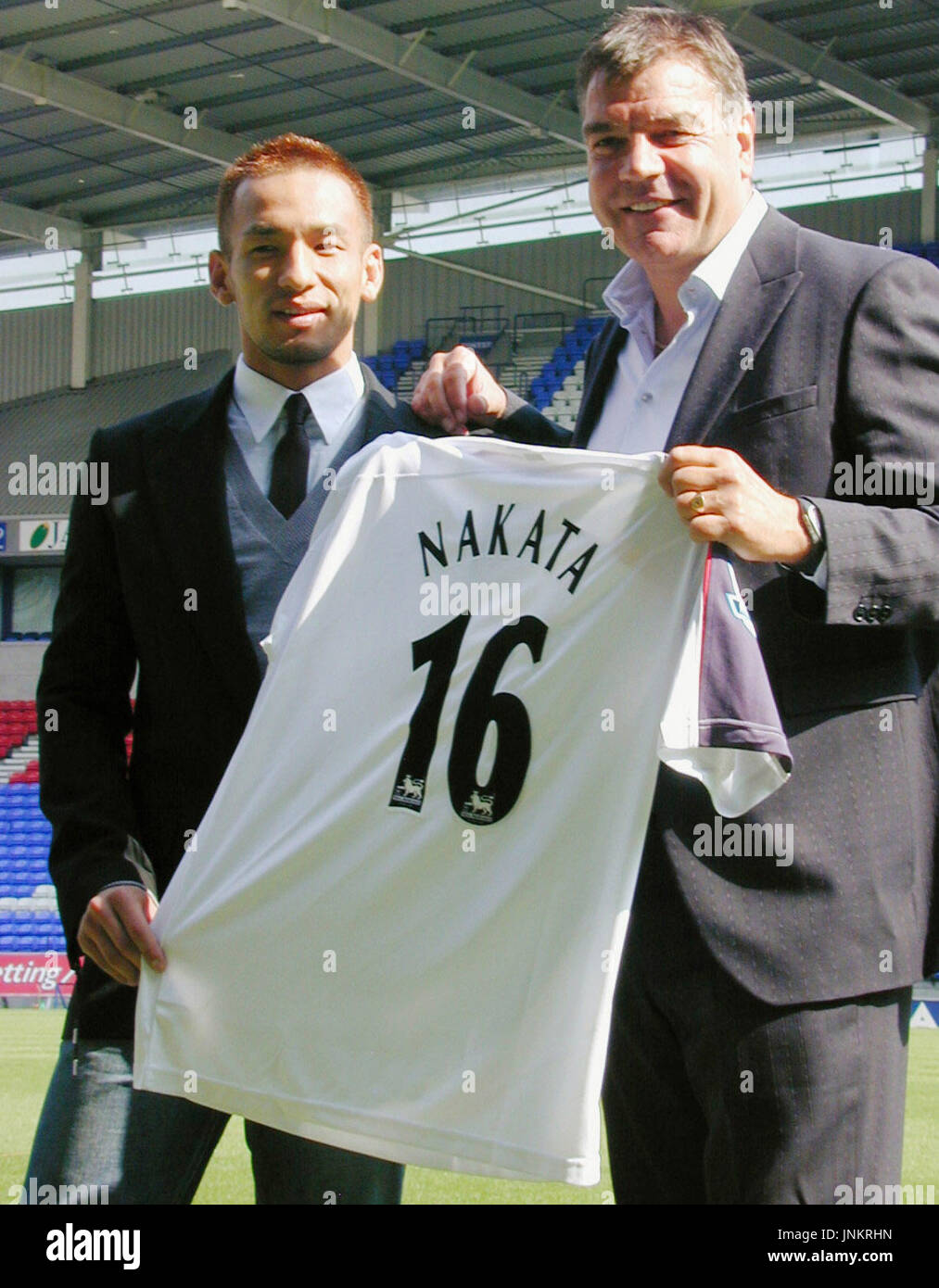 BOLTON, England - Japanese International Hidetoshi Nakata (L) shows off ...