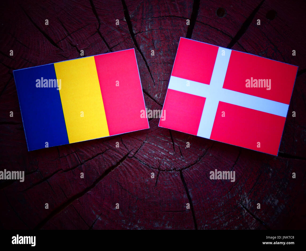 Chad flag with Danish flag on a tree stump isolated Stock Photo - Alamy