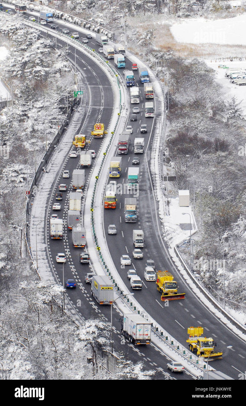 RYUO, Japan - Cars run at a snail's speed on the Meishin Expressway ...