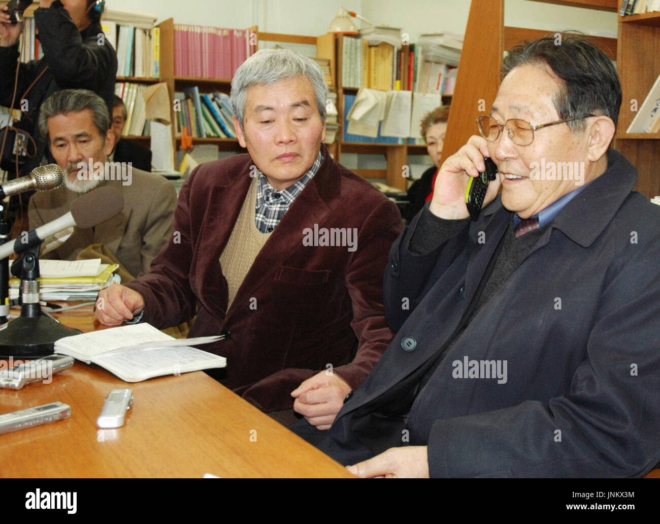 NAGASAKI, Japan - Nobuto Hirano (C), leader of a Japanese support group ...