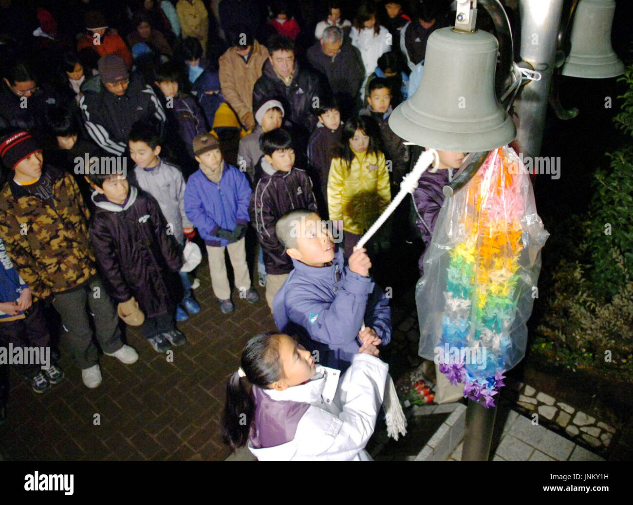 NISHINOMIYA, Japan - Children ring a bell at Takagi elementary school ...