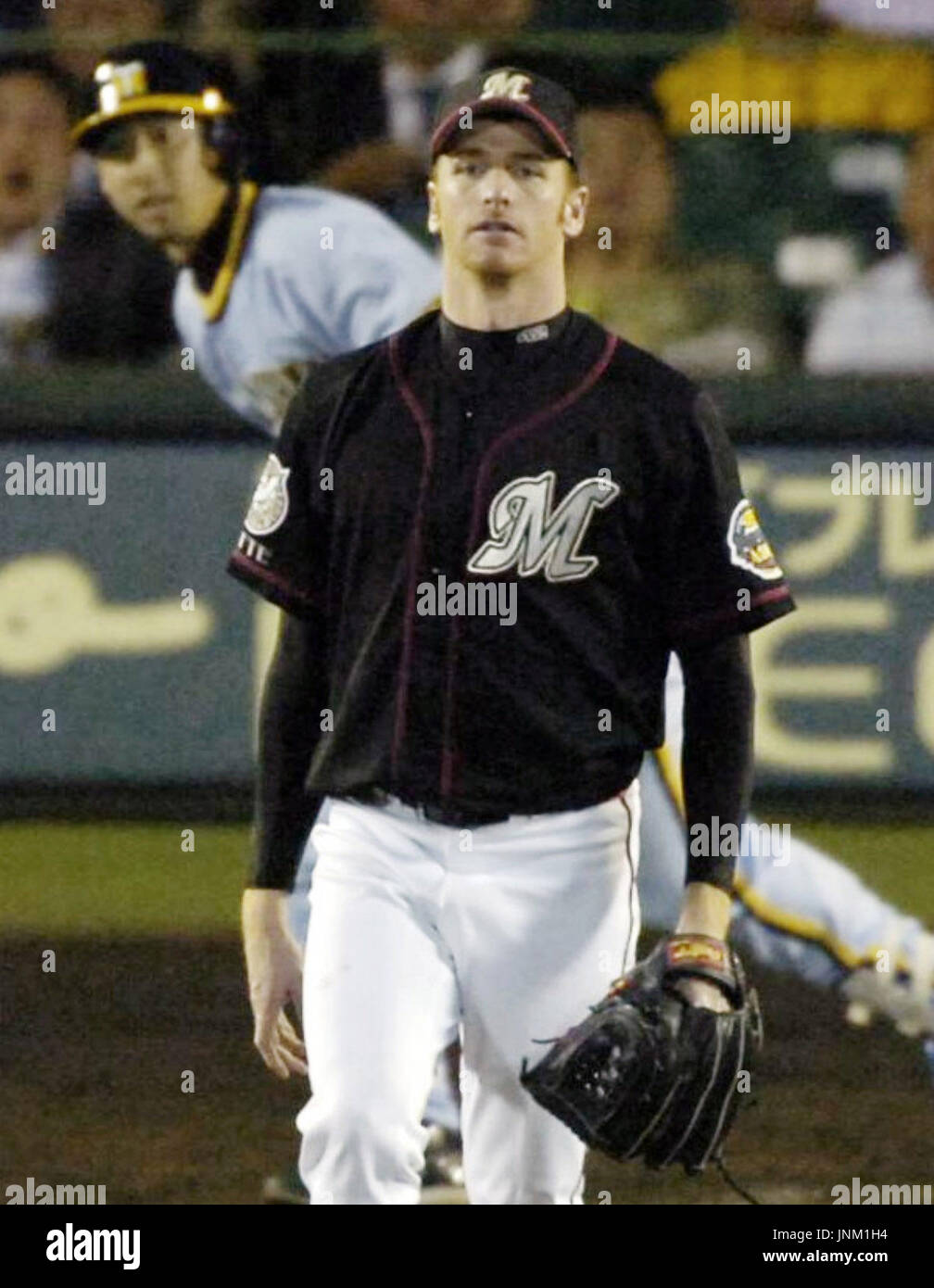 KOSHIEN, Japan - Lotte Marines starter Kevin Beirne watches the solo ...