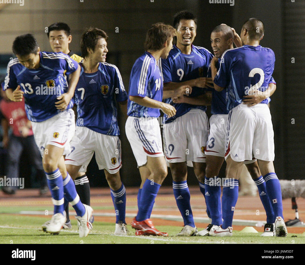TOKYO, Japan - Japan defender Alessandro Santos (2nd from R) gets ...