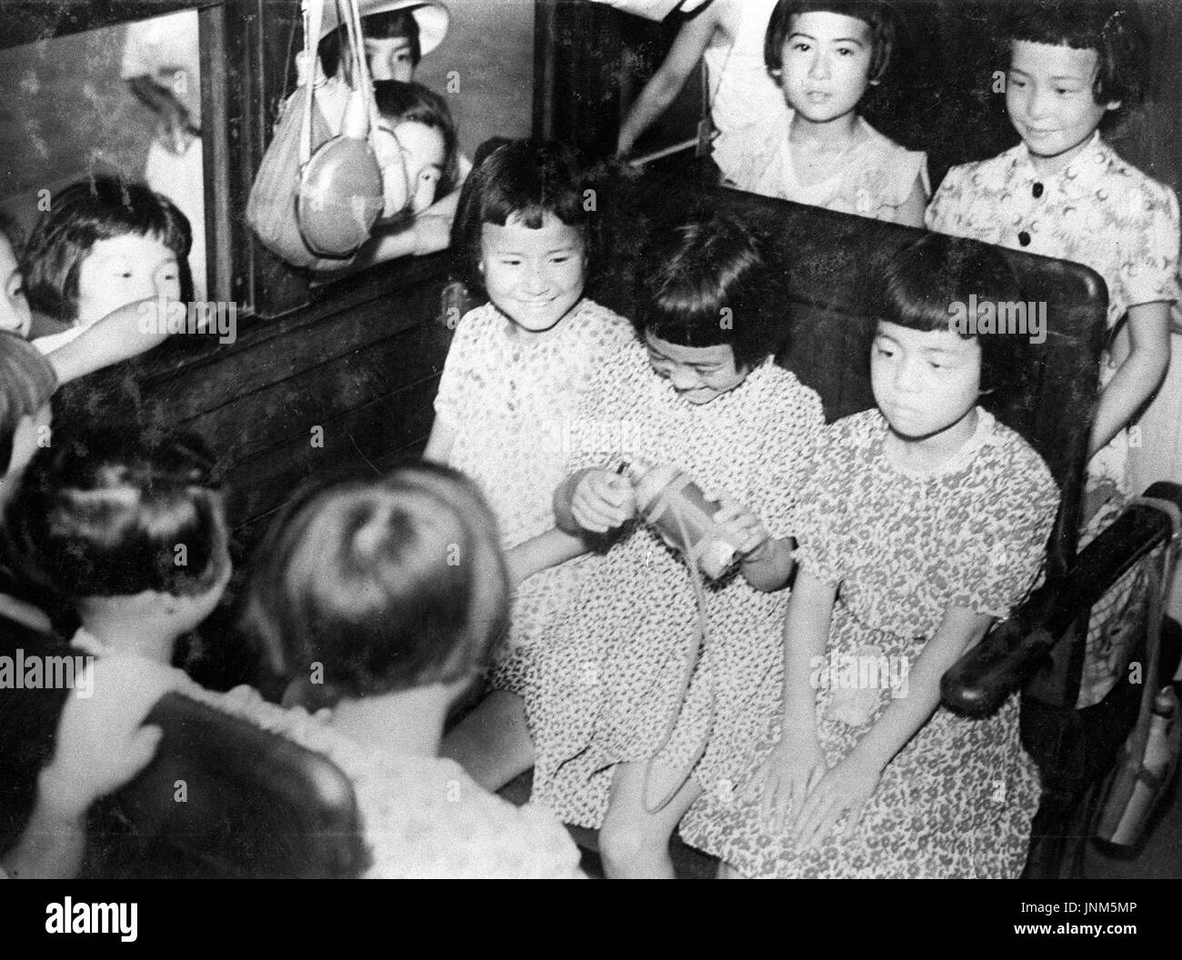 TOKYO, Japan - Schoolchildren inside the train are being evacuated for ...
