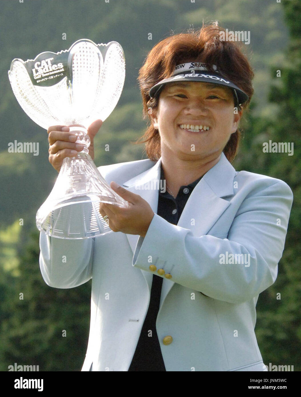 HAKONE, Japan - Mikiyo Nishizuka holds up her trophy after winning the ...
