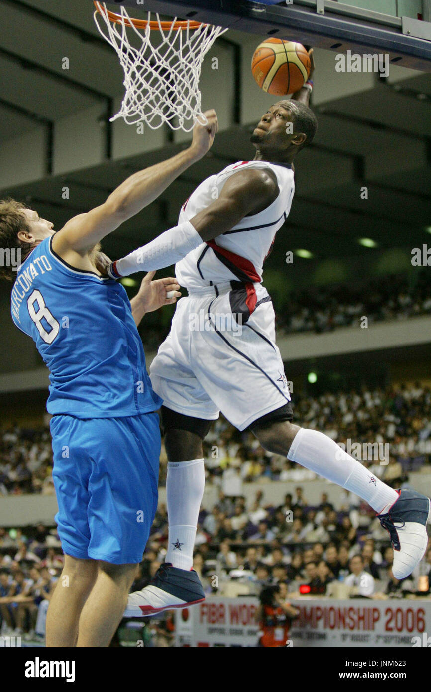 SAPPORO, Japan - Dwyane Wade (R) attemps to slam dunk against Italy's ...