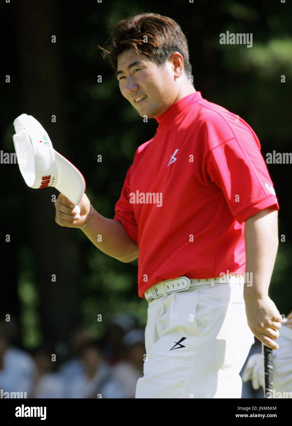 CHIBA, Japan - Y.E. Yang of South Korea doffs his cap after winning the ...