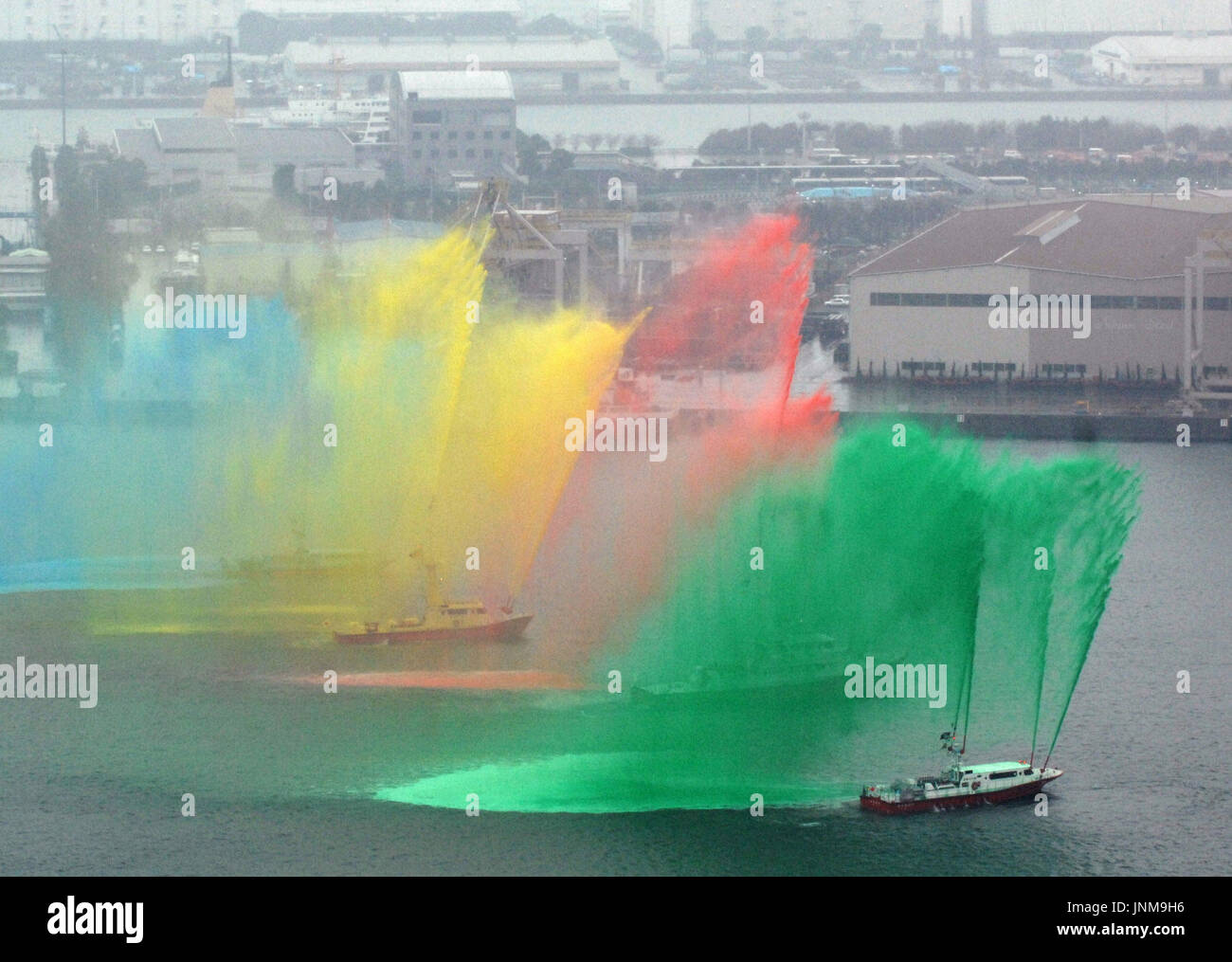 TOKYO, Japan - Firefighters discharge colored water into Tokyo Bay ...
