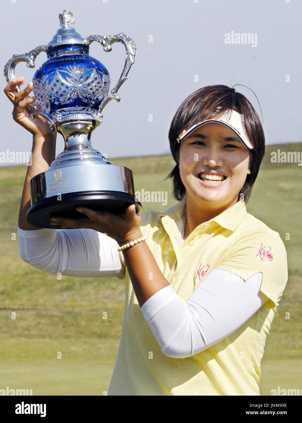 TAKAMATSU, Japan - Jeon Mi Jeong of South Korea holds up her trophy ...