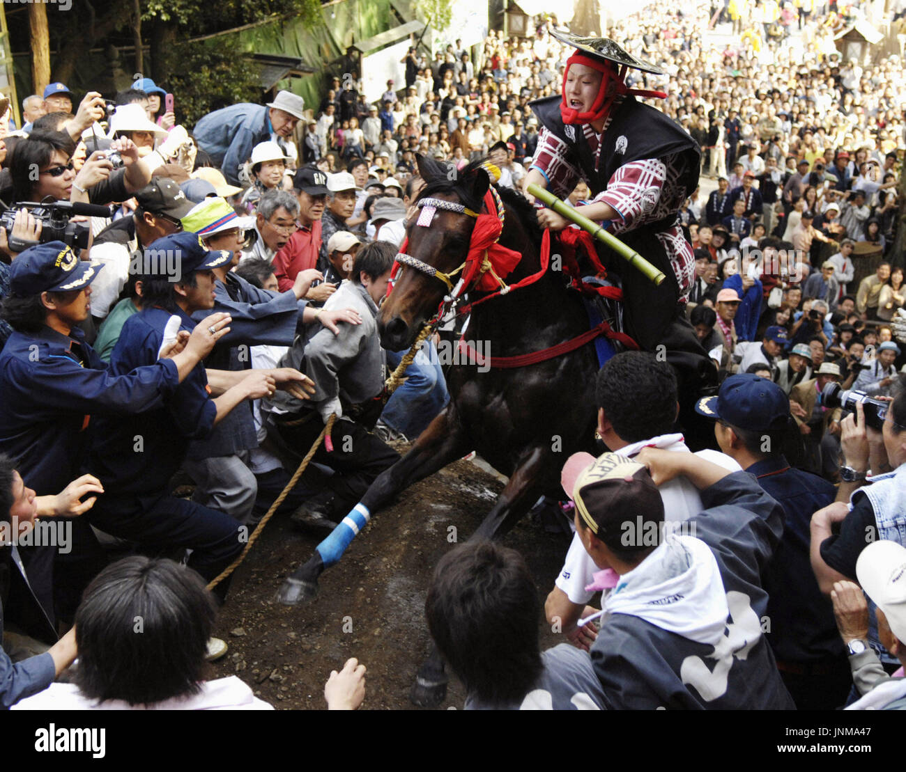 KUWANA, Japan - A leap-over-the-wall event is held at Dado Shrine in ...